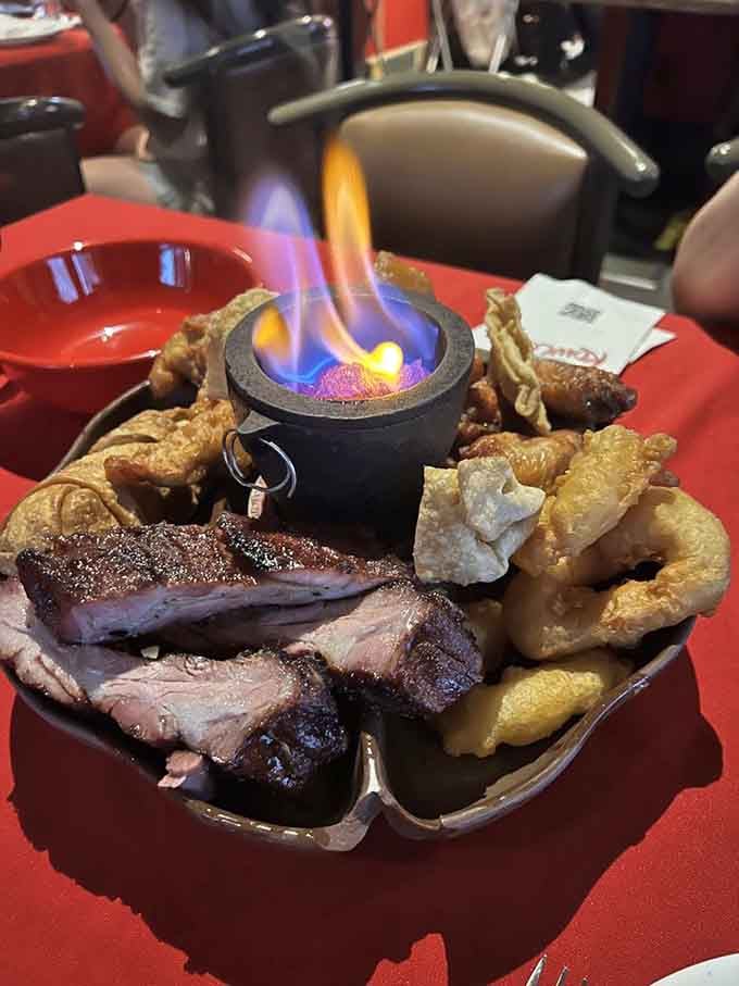 The flaming Pu Pu Platter arrives like a delicious volcano, proving dinner can absolutely be theatrical entertainment too.