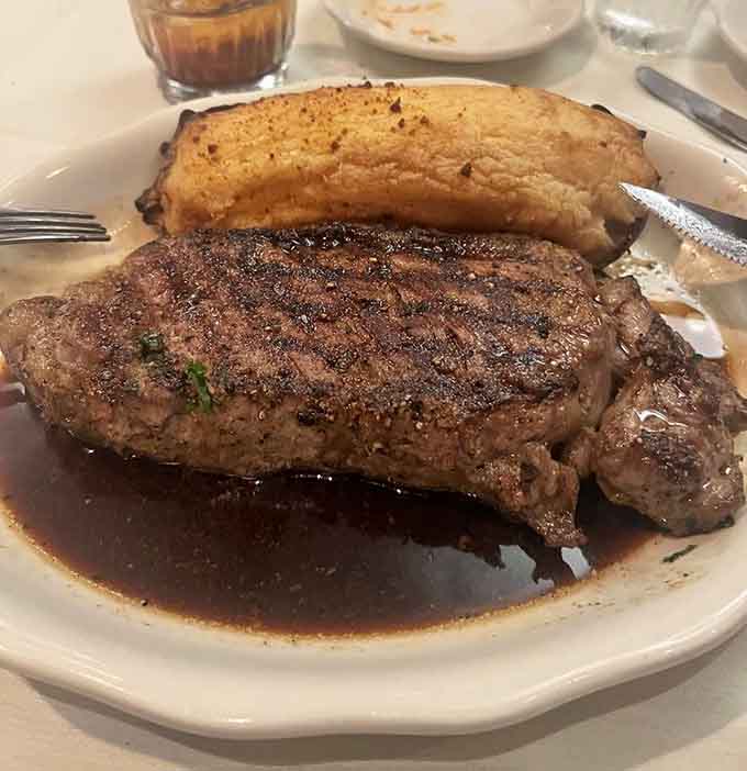 The New York Strip arrives with enough presence to make neighboring tables turn green with envy and hunger.