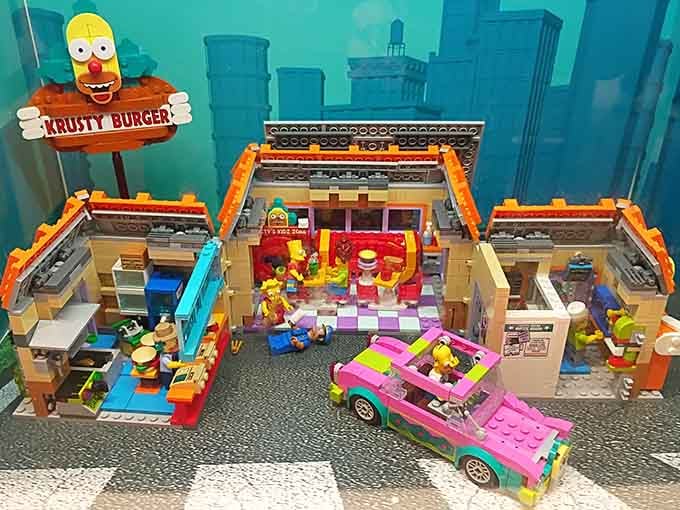 The Krusty Burger gets the LEGO treatment, complete with pink sedan and Springfield's finest pixelated charm.