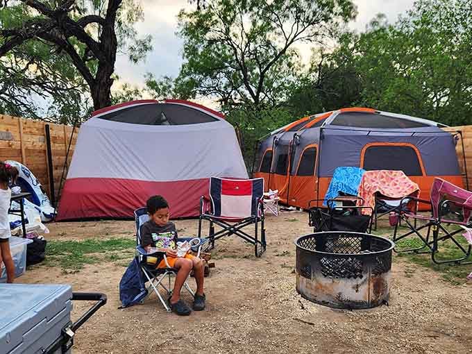 Camping under the stars with a fire ring ready, because s'mores taste better near crystalline water.