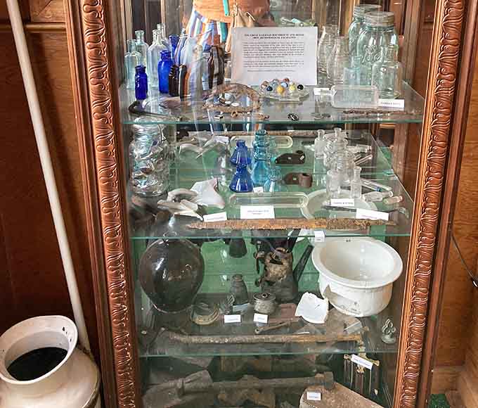Antique bottles that once held everything from medicine to moonshine, each one a tiny time capsule of daily life.