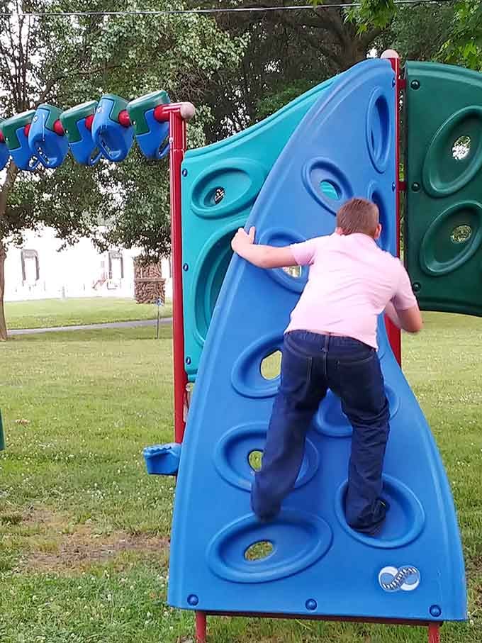 Kids conquer this climbing wall with the determination of tiny mountaineers scaling Everest, minus the oxygen tanks and frostbite.