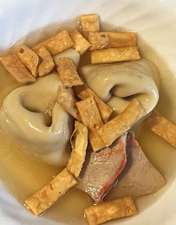 Roast pork wonton soup delivers comfort in a bowl, proving that even paradise needs its cozy moments sometimes.