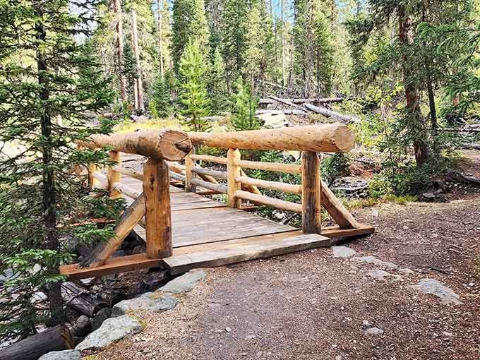 Rustic bridge spans mountain streams, each crossing a small adventure in your journey through history.