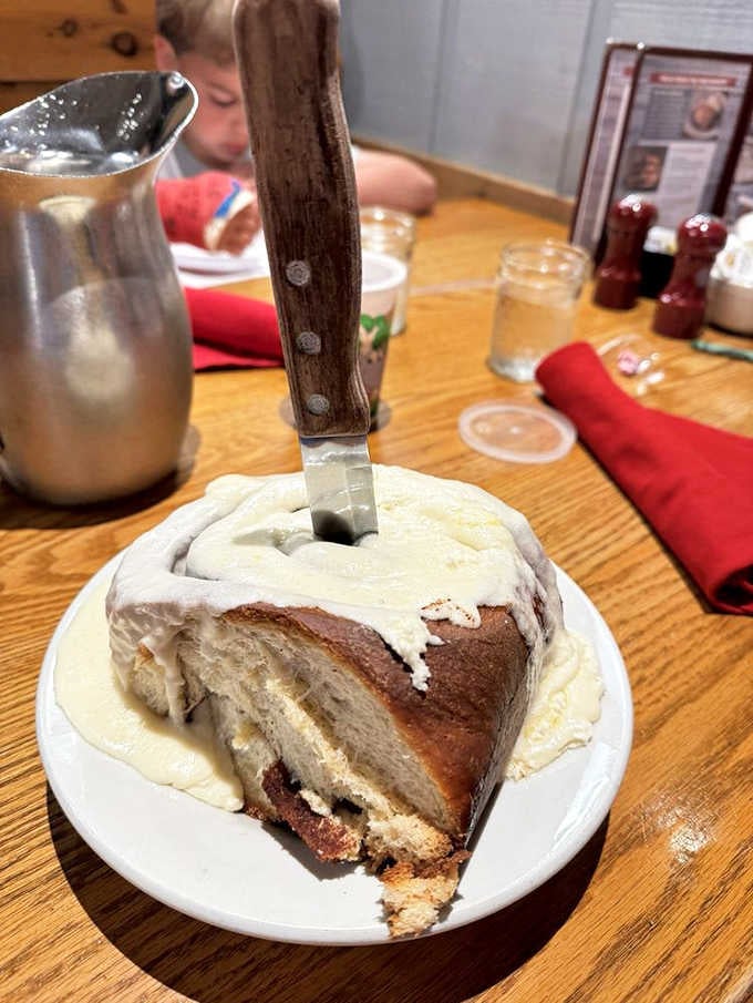 That cinnamon roll requires a knife just to prove it's real and not a delicious fever dream.
