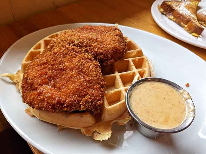 Crispy fried chicken meets fluffy waffles in a combination that defies logic but delivers pure joy.