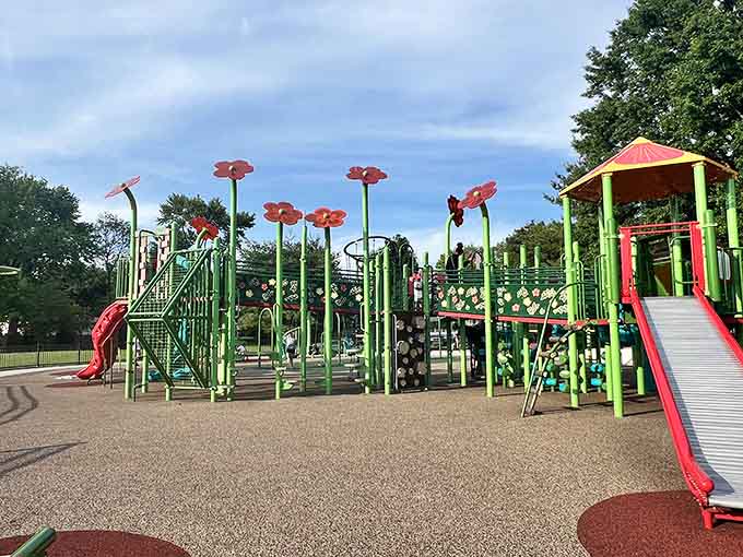 Bright flowers tower overhead like a Dr. Seuss illustration come to life, adding whimsy to every climbing adventure below.