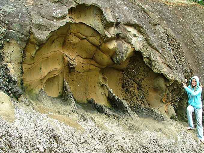 These eroded sandstone cliffs look like nature's abstract art installation, carved by thousands of years of patience.