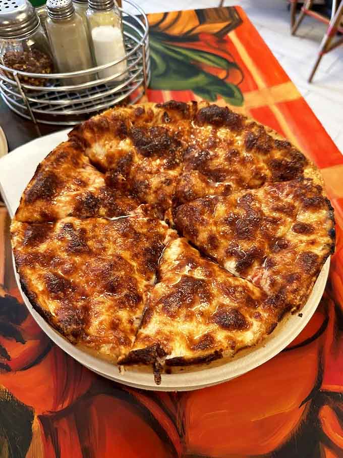 That golden-brown perfection is what happens when cheese meets crust directly, creating pure pizza alchemy every time.