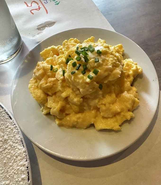 Fluffy scrambled eggs topped with fresh chives prove that brunch here is just as serious as dinner service.