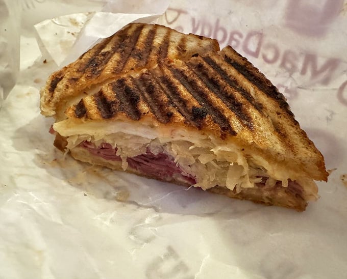Those perfect grill marks on a classic Reuben prove that some traditions deserve respect, sauerkraut, and melted Swiss cheese.
