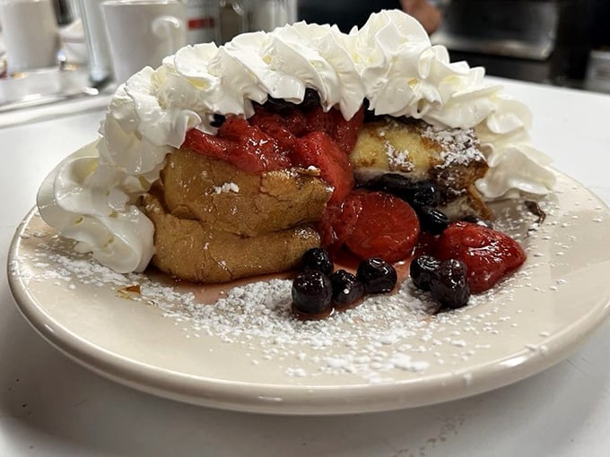 Fresh berries, whipped cream mountains, and golden French toast create a dessert-for-breakfast masterpiece that would make your grandmother smile.
