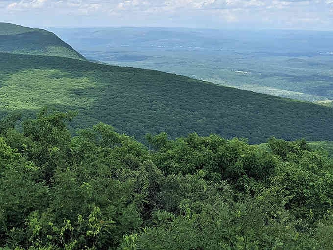 Rolling green mountains stretch endlessly, proving Connecticut has more layers than your favorite lasagna.