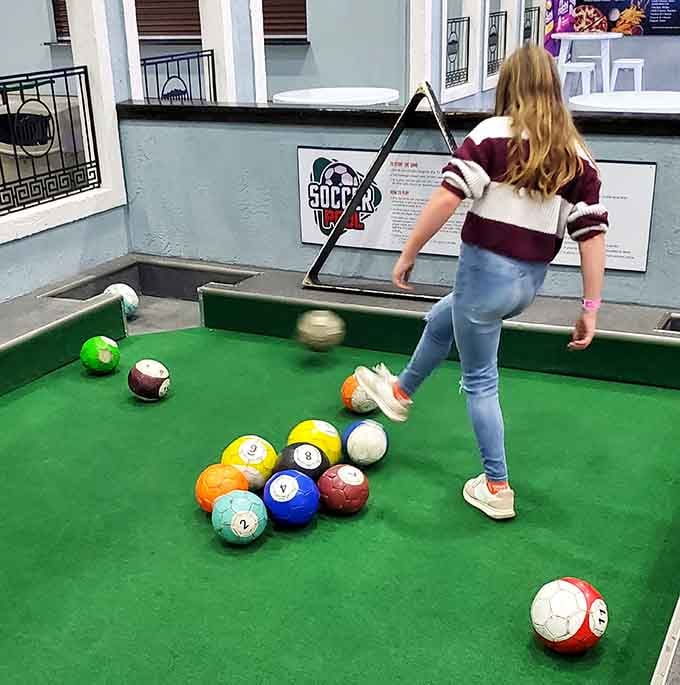 Giant soccer pool balls meet billiards in this oversized game that's part playground, part rec room nostalgia.