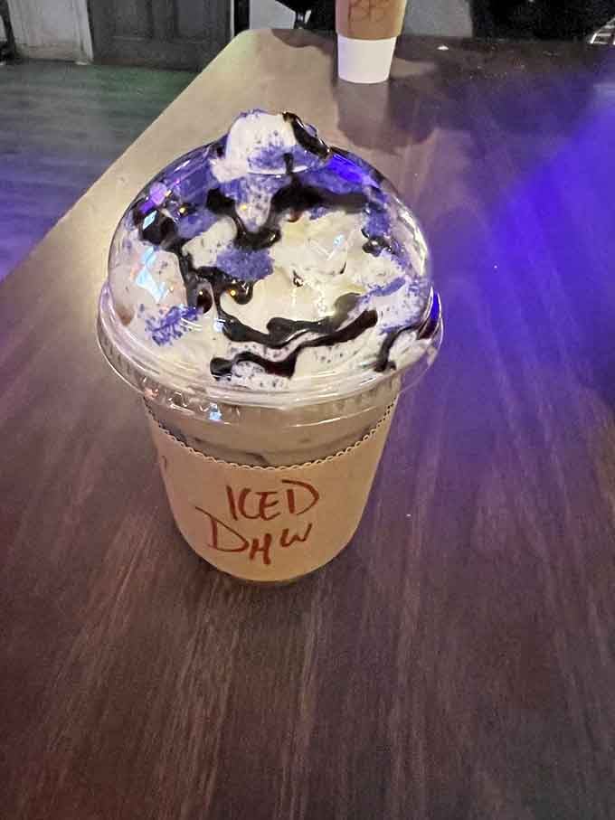 The Deathly Hallow Latte comes with purple whipped cream and chocolate drizzle that's positively enchanting in every sip.
