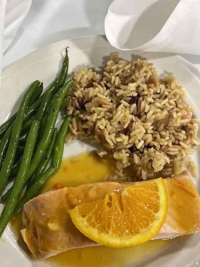 Fresh salmon with rice pilaf and vegetables&mdash;because solving mysteries requires brain food, and this dish delivers deliciously on that promise.