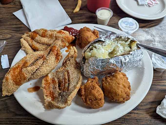 When your catfish comes with a foil-wrapped baked potato, you know someone's thinking about the complete dining experience here.