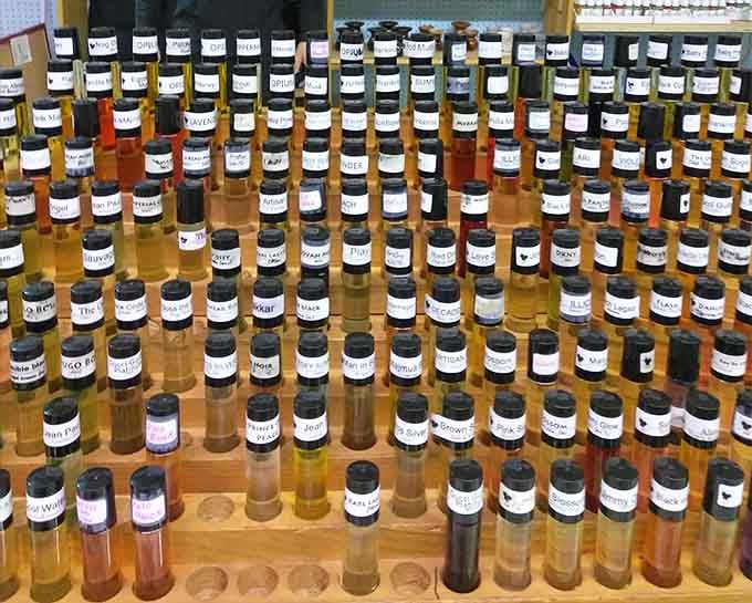 Rows of fragrance bottles standing at attention, offering scents from classic to mysterious at wallet-friendly prices.