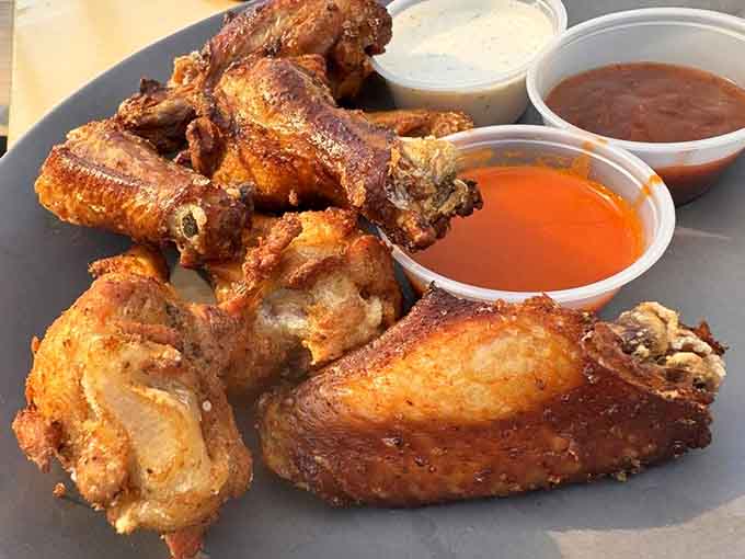 These golden-brown wings with their trio of sauces are basically the reason humans invented the concept of happy hour.