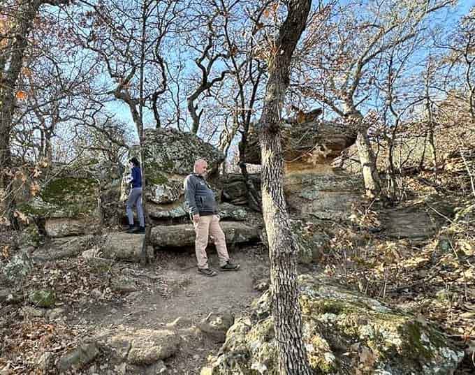Fellow explorers examining the rock formations&mdash;misery loves company, but so does adventure and mild trespassing feelings.