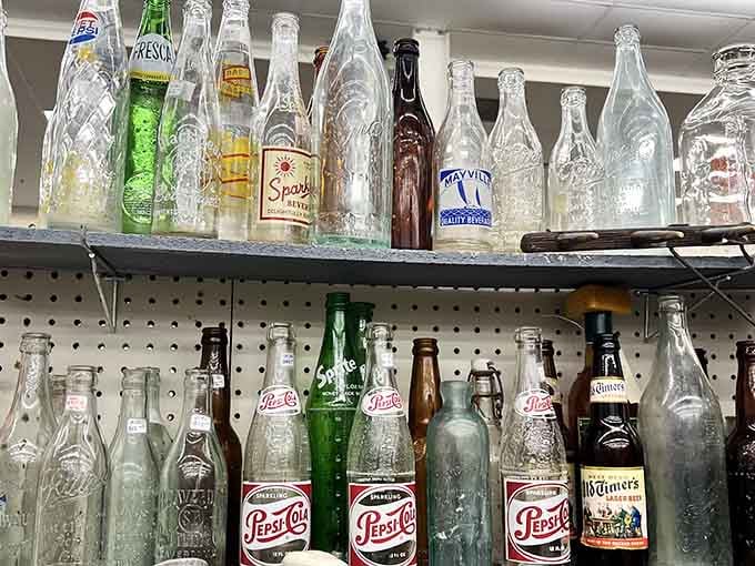 Old Pepsi bottles lined up like soldiers, reminding us when soda came in glass and tasted like childhood.