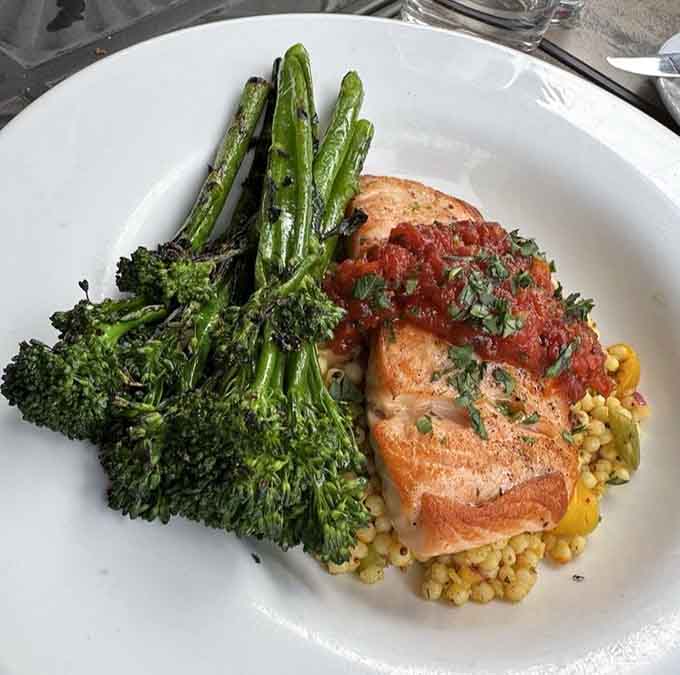 Perfectly cooked salmon with broccolini and couscous shows that simple preparations let quality ingredients shine brightest.