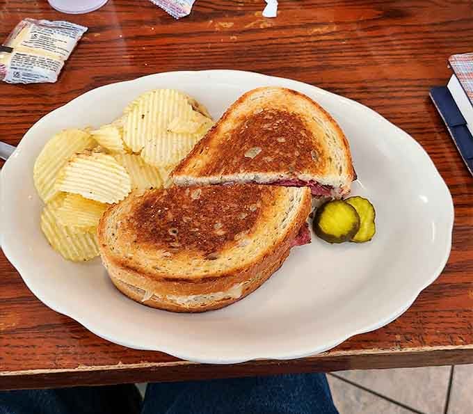 A Reuben that looks like it was assembled by someone who actually cares about proper sandwich architecture and flavor.