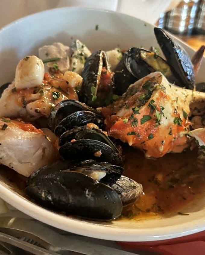 Shrimp, scallops, and mussels swimming together in broth that deserves its own standing ovation and encore performance.
