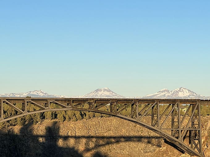 Snow-capped Cascade peaks provide a stunning backdrop to the bridges, because Oregon never does anything halfway.