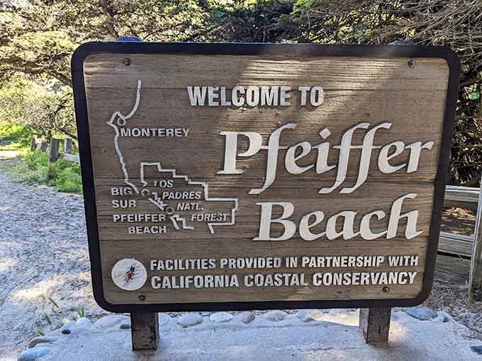 The welcome sign is modest. The beach behind it is anything but.