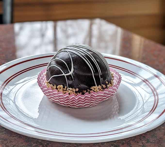 This chocolate mousse bombe is proof that sometimes the best things in life are round, shiny, and completely indulgent.