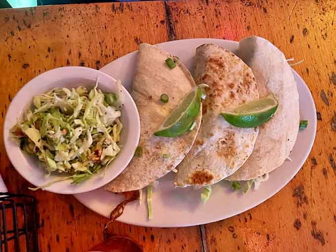 Fresh fish tacos bring coastal brightness to balance all that delightful gothic atmosphere swirling around inside.