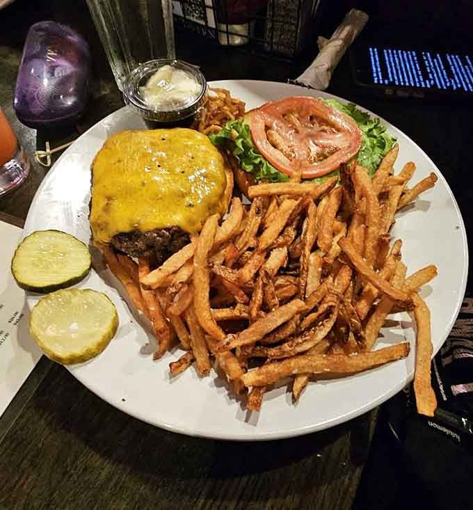 That golden melted cheese cascading over the patty looks like something from a 1950s diner dream sequence.