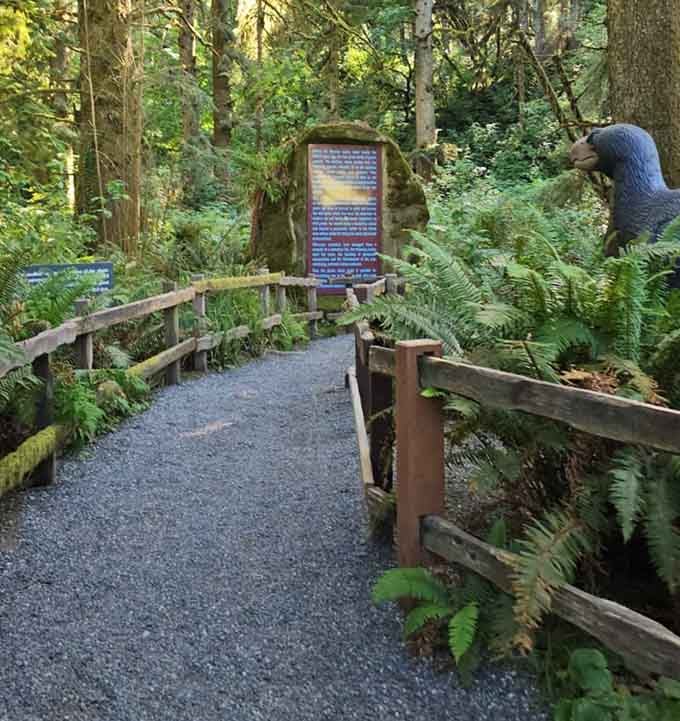 The gravel path winds through ferns and mystery, promising dinosaur encounters around every mossy corner ahead.