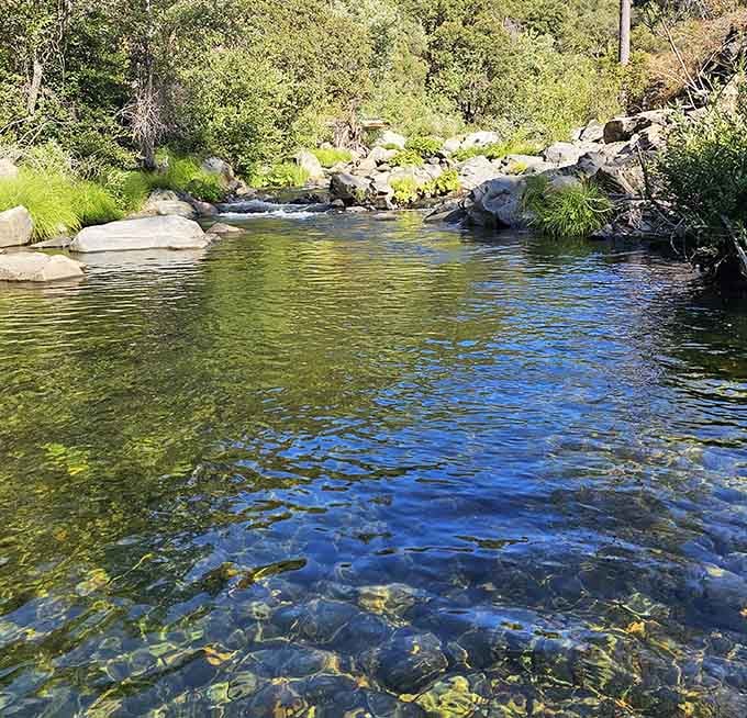 Crystal-clear waters reveal every pebble below, proving Mother Nature doesn't need a filtration system to show off.