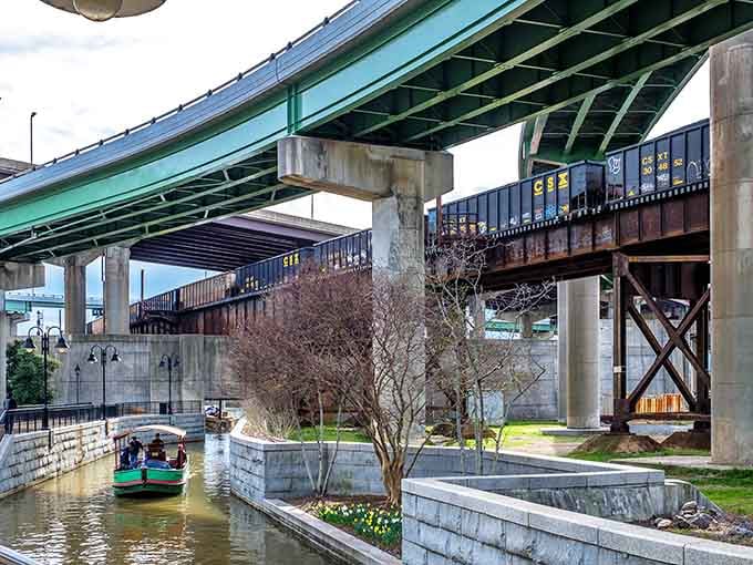 Multiple bridges create a layered cityscape above the canal, each one telling its own story about Richmond's evolution.