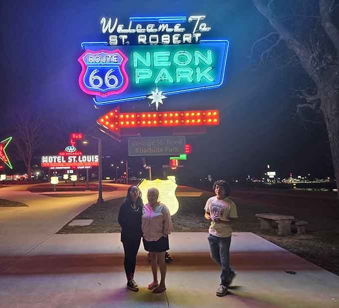 The main entrance sign glows brilliantly at night, creating the perfect backdrop for your Route 66 pilgrimage photos.