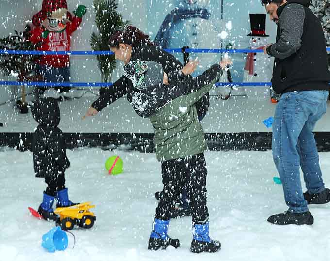 Nothing says family bonding quite like pelting each other with snowballs while wearing winter coats in the middle of summer.