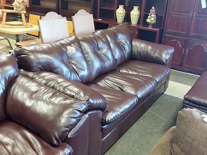 That buttery leather sofa looks like it belongs in a gentleman's club, minus the cigar smoke and membership fees.