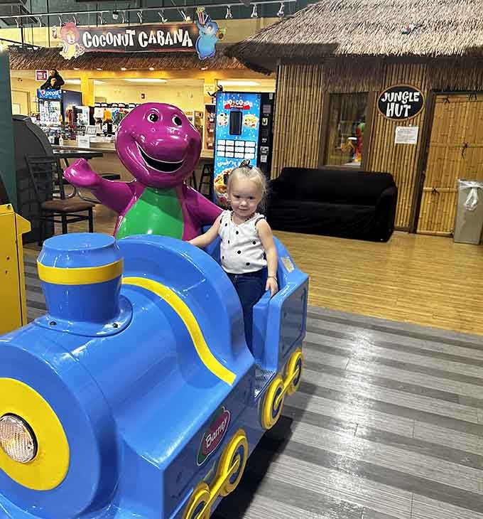 That purple dinosaur conductor knows the secret to happiness: a train ride that goes absolutely nowhere but everywhere.