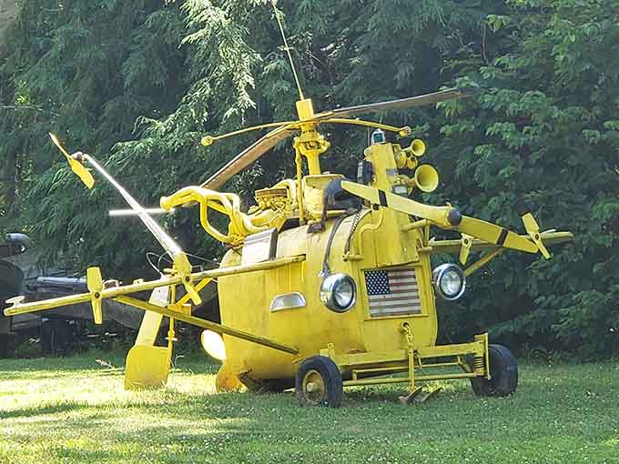 A bright yellow helicopter sculpture that looks ready to lift off and buzz around Erie.