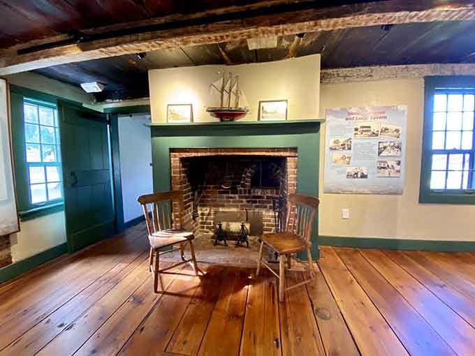 Two chairs by the hearth, perfectly positioned for either a cozy chat or waiting for ghostly guests to arrive.