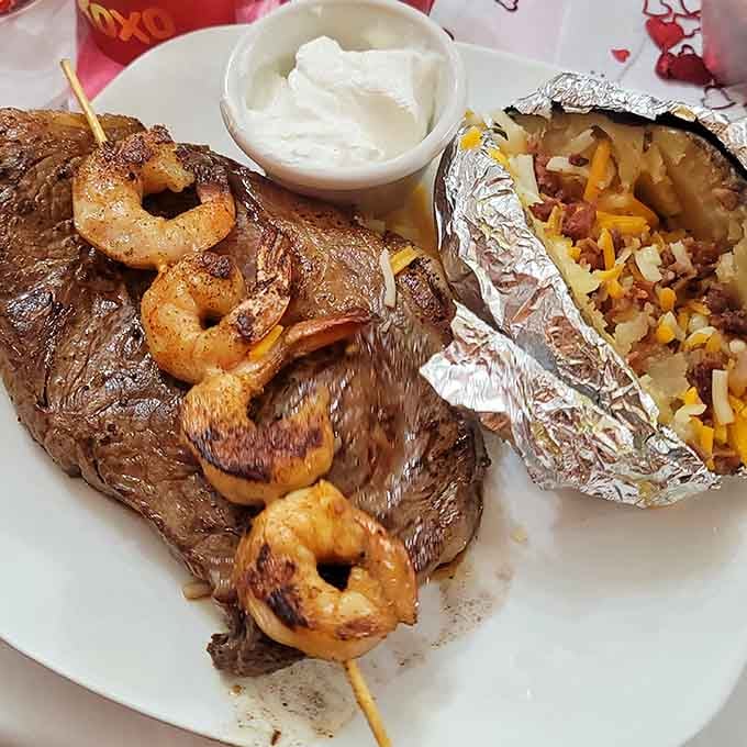 When surf meets turf on a single plate, complete with a loaded baked potato that deserves its own spotlight.