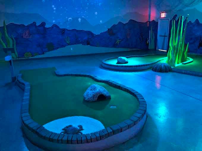Underwater scenes with moody blue lighting transform ordinary mini golf into an oceanic adventure worthy of Jacques Cousteau's putting skills.