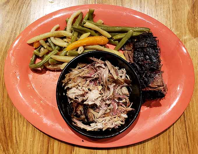 Pulled pork so tender it surrenders without a fight, served with green beans that actually taste good.