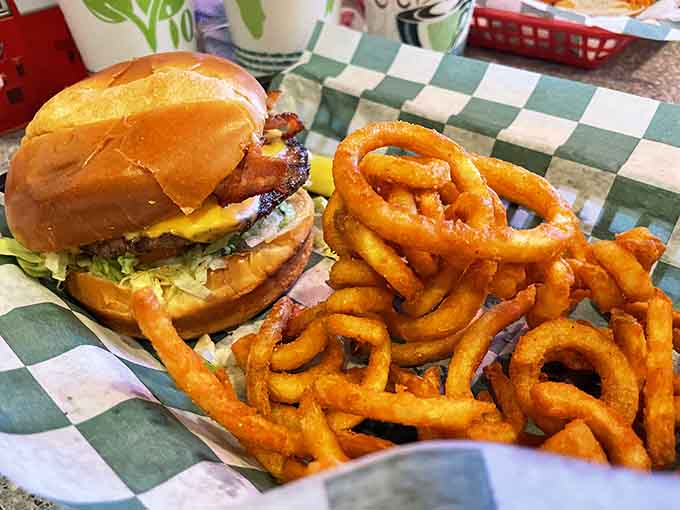 This burger with onion rings stacked high understands that sometimes more really is more, and we're here for it.