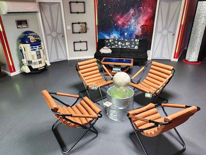 Lounge chairs arranged around a nebula backdrop, because apparently aliens have better interior design sense than most humans.