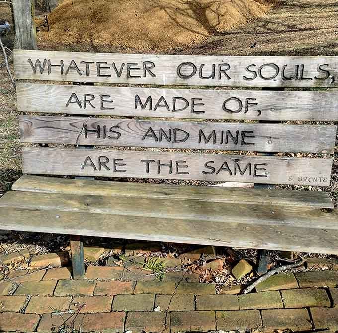 A simple wooden bench bearing a profound message about our shared humanity that hits harder in this setting.