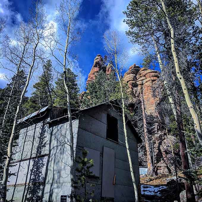 Dramatic rock formations tower above the forest, showcasing the stunning geological features that make hiking at Staunton State Park so memorable.