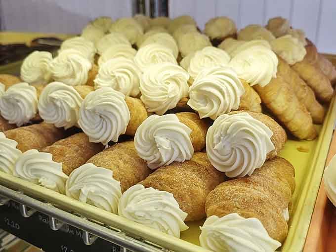 Cream-filled pastries piped with such precision they belong in a museum, or better yet, your mouth.